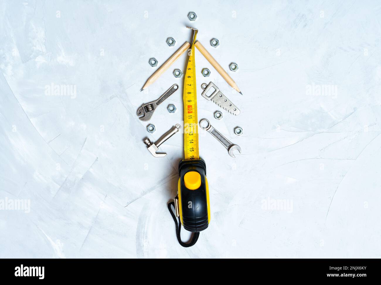 New year tree made from a roll meter and small copies of construction ...