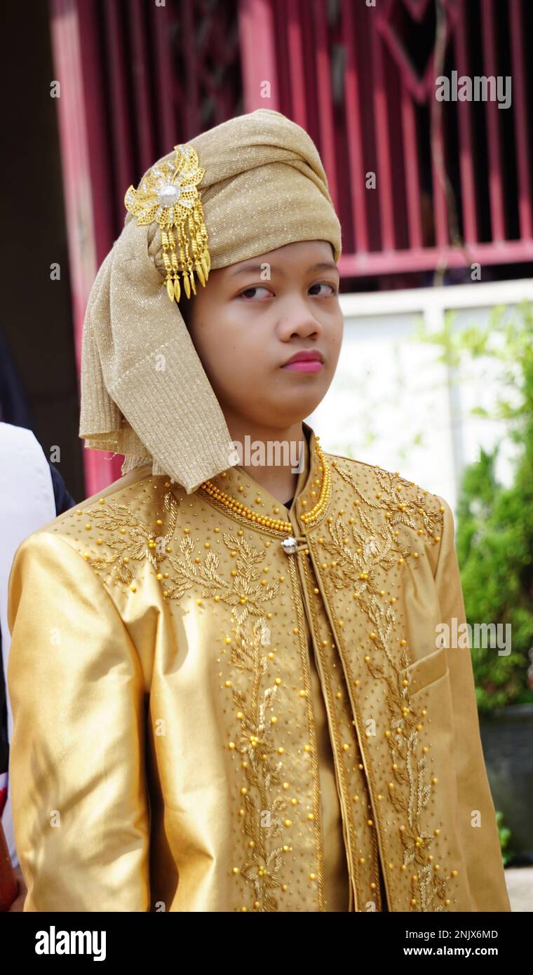 Indonesian with a traditional Minangkabau clothes on 1800 chocolate ...