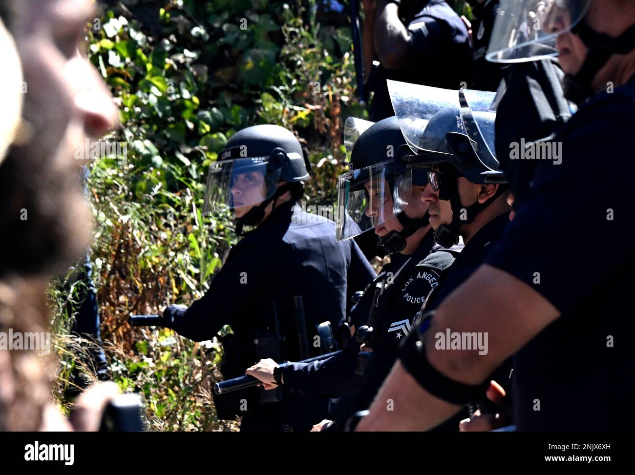 Los Angeles Police Department officers clash with activists as they ...