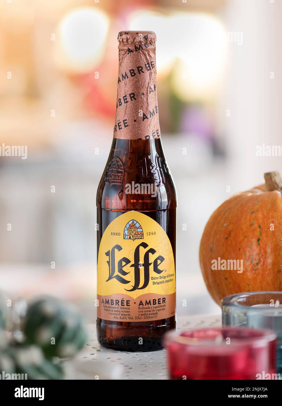 Leffe beer bottle placed on table with orange pumpkin and candles ...