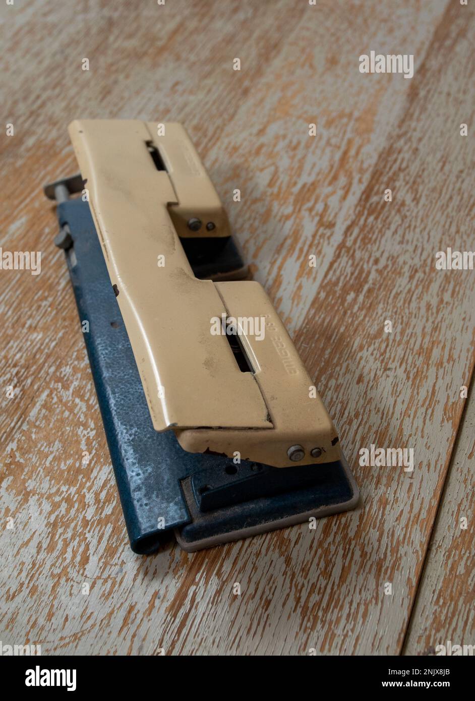 Substantially fabricated metal four hole punch ... old school Stock ...