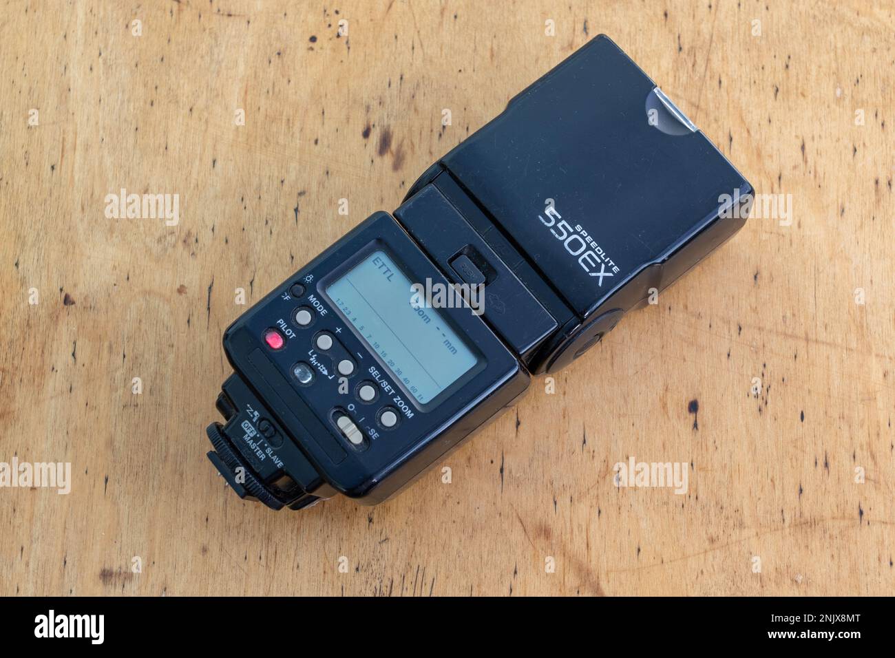 Canon 550EX Speedlite/flash gun/strobe with the head hinged up and ...