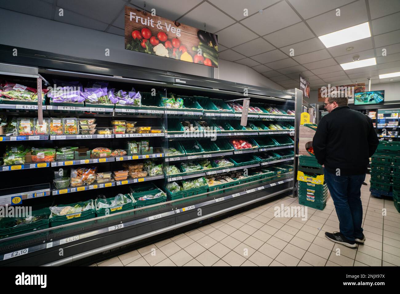 London, UK. 23 February 2023.. A shopper browsing the Fruit and ...