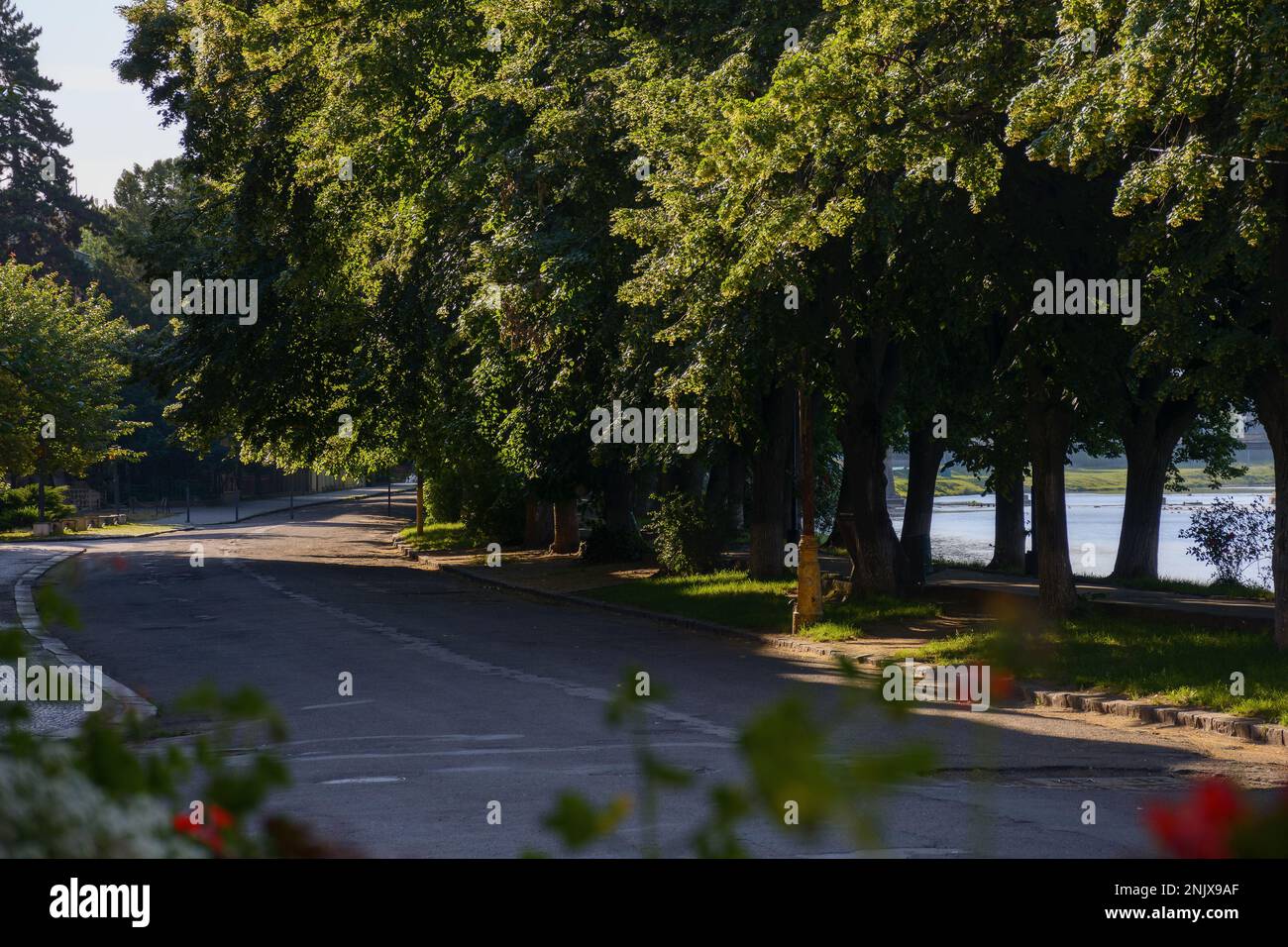 river waterfront at sunrise. cityscape in summer. warm sunny weather ...
