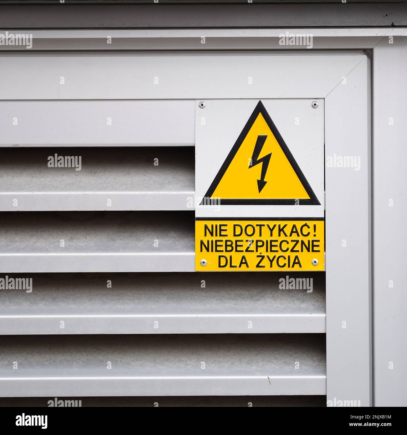 A closed door, with a sign posted on it indicating that the building is ...