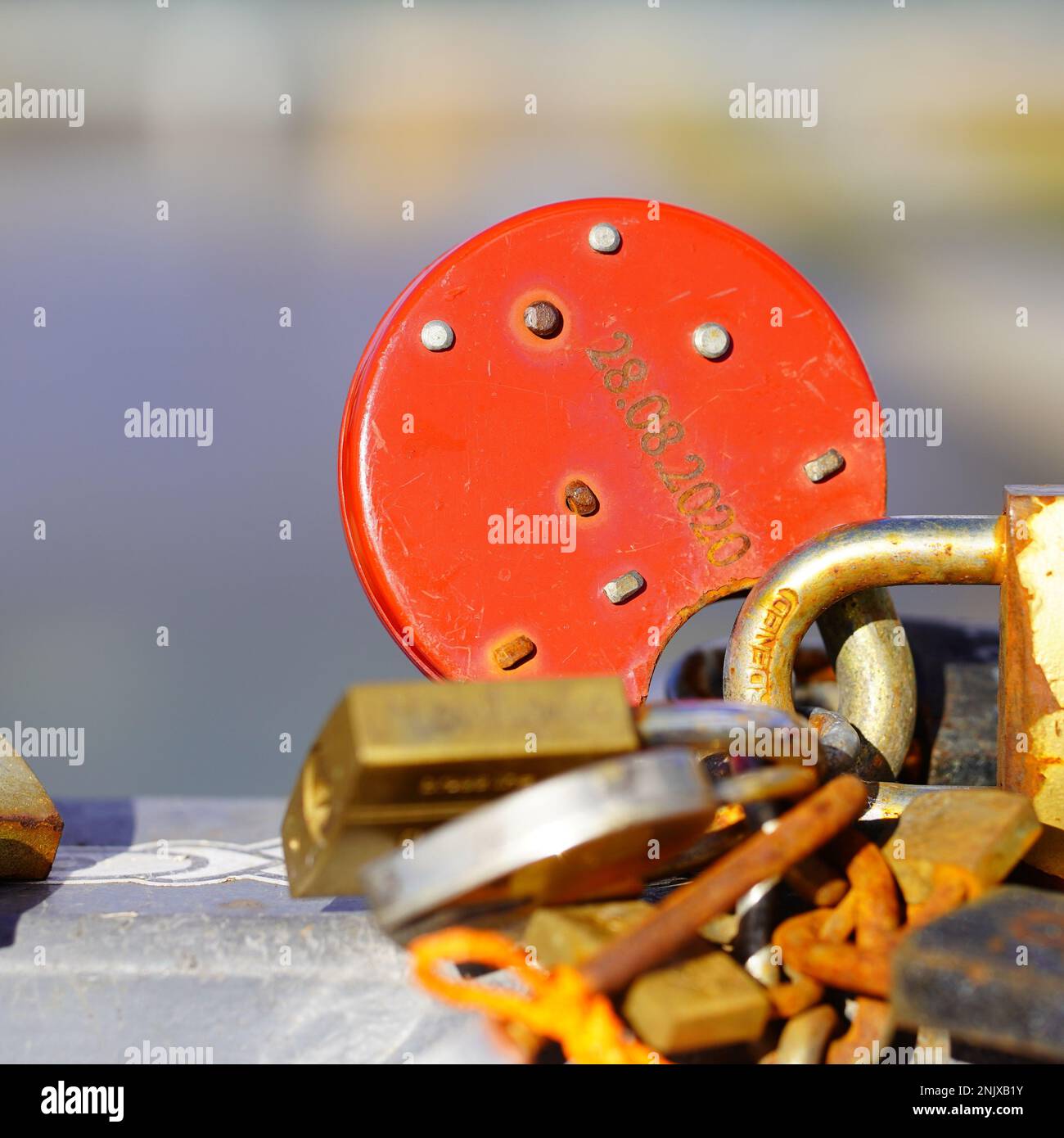 An array of padlocks and keys in various colors arranged in a line ...