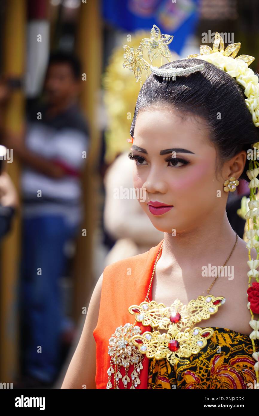 Indonesian with a traditional javanese cloth on 1800 chocolate ketupat ...