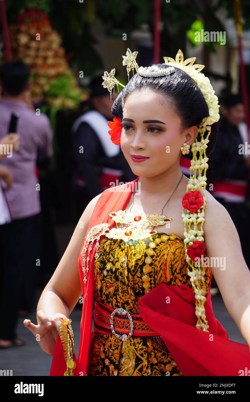 Indonesian with a traditional javanese cloth on 1800 chocolate ketupat ...