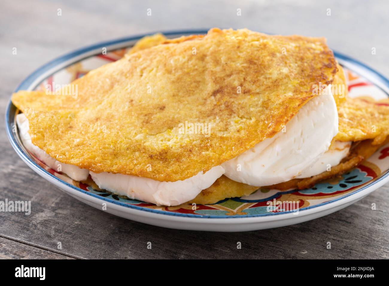 Traditional Venezuelan beef cachapa on wooden table Stock Photo - Alamy