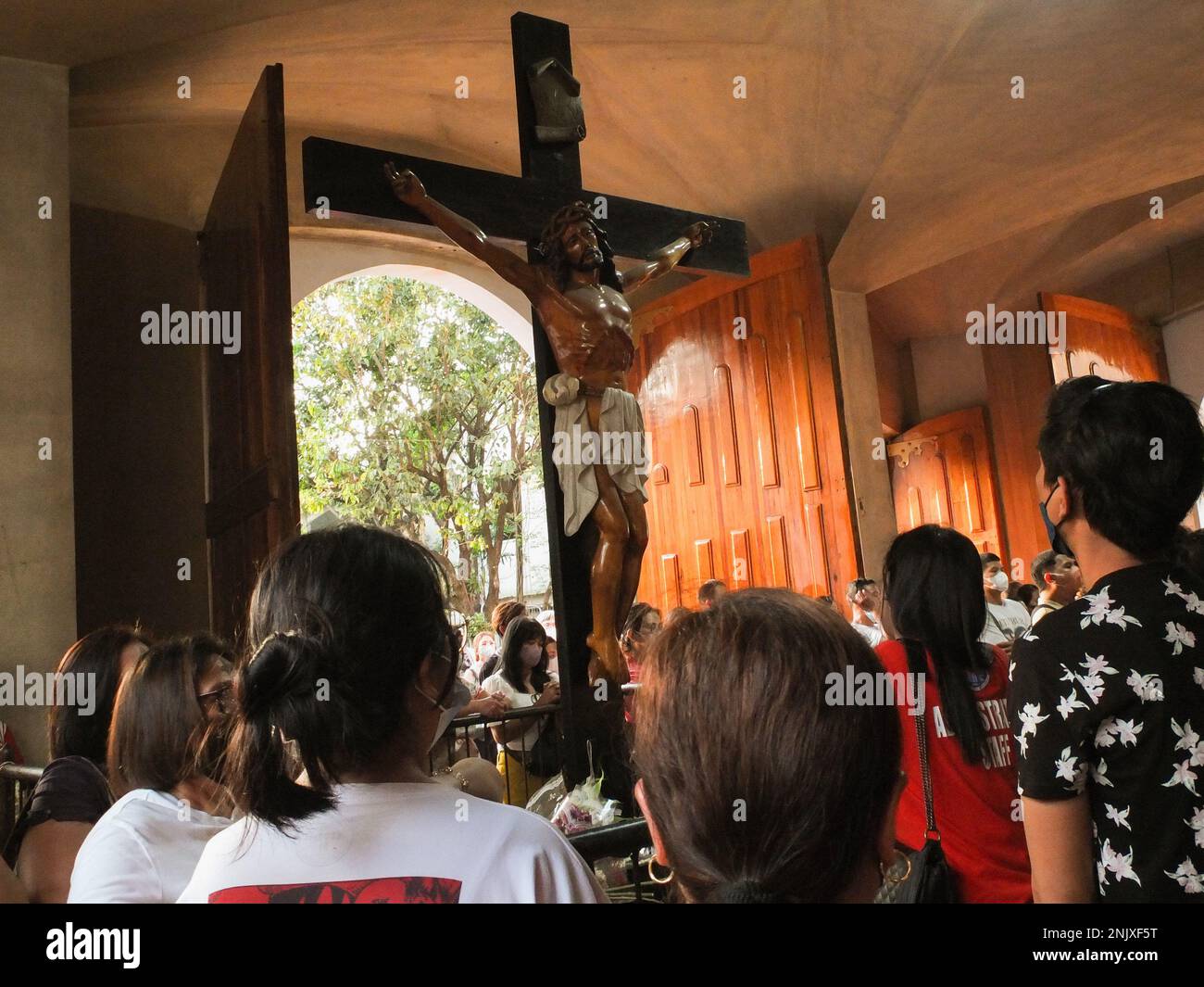 A life-size replica of a crucified Christ seen inside the Baclaran ...
