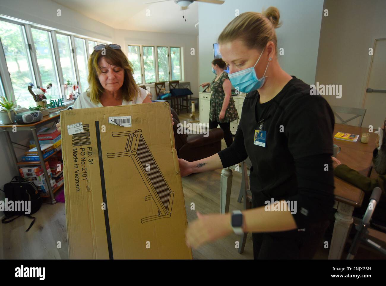 Founding director Sherry Campbell, left, and nurse Kayleen Becker work ...