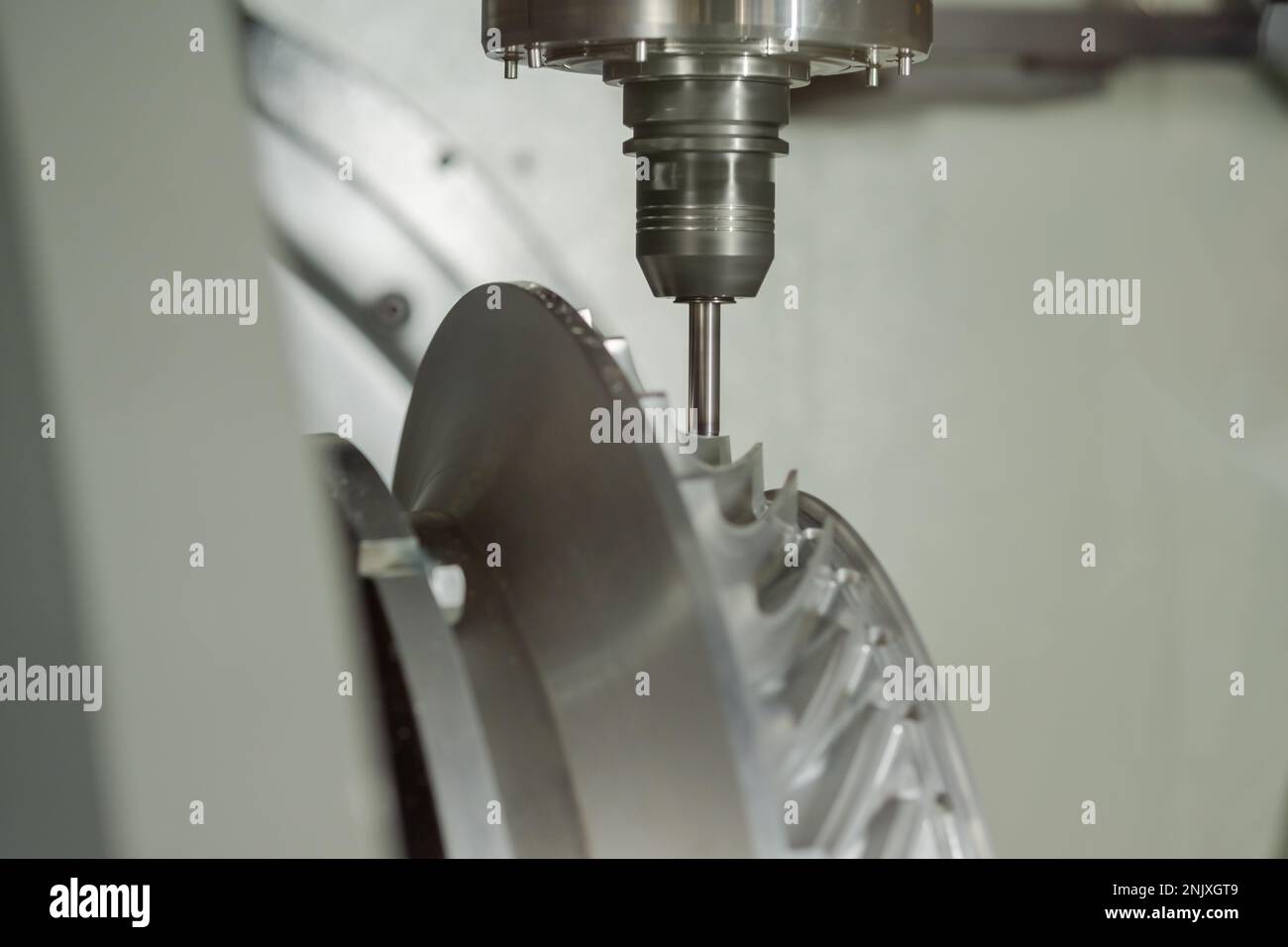 Automated cnc turning milling machine cutting metal workpiece at ...