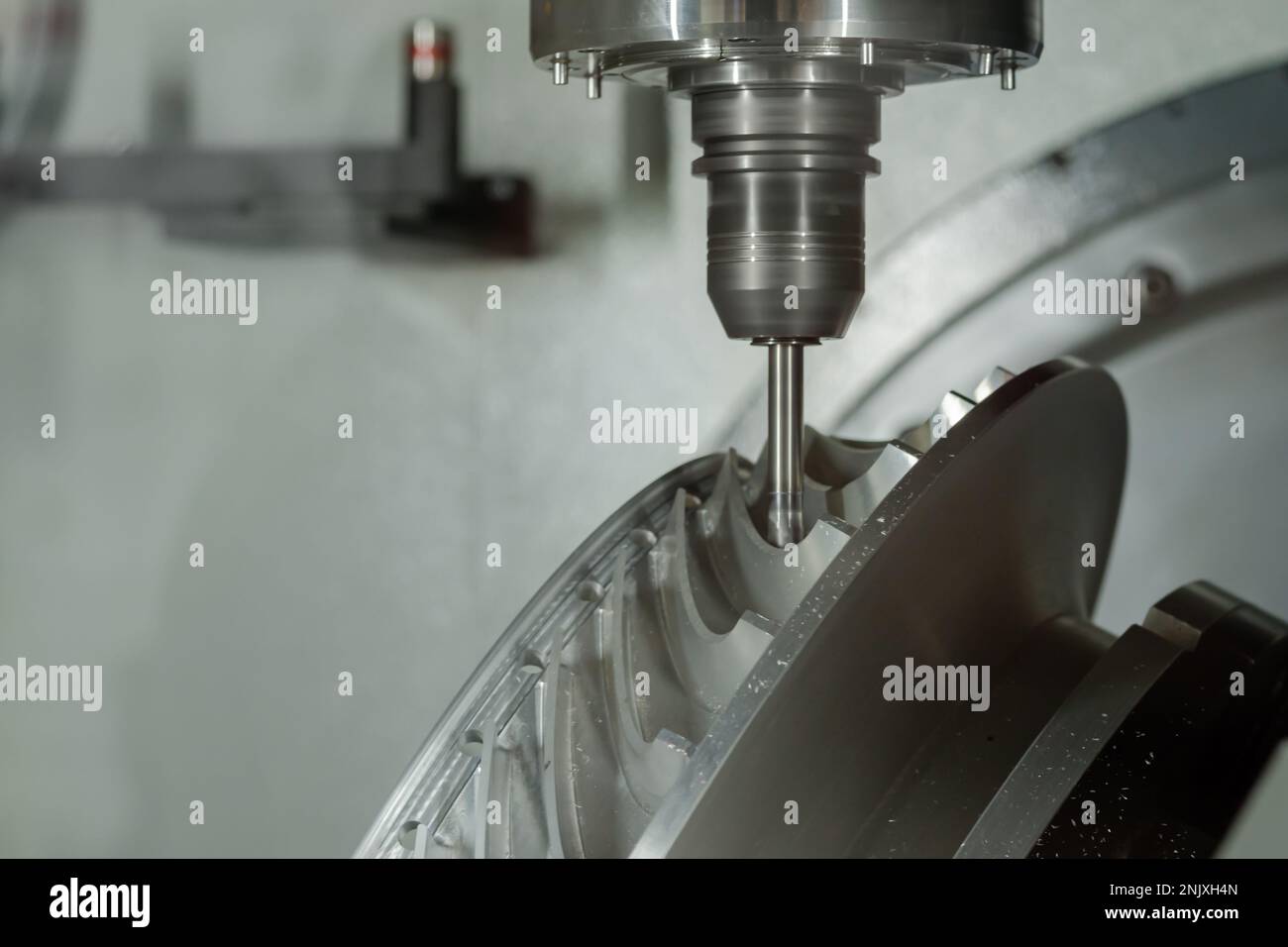 Close up: cnc turning milling machine cutting metal workpiece at ...