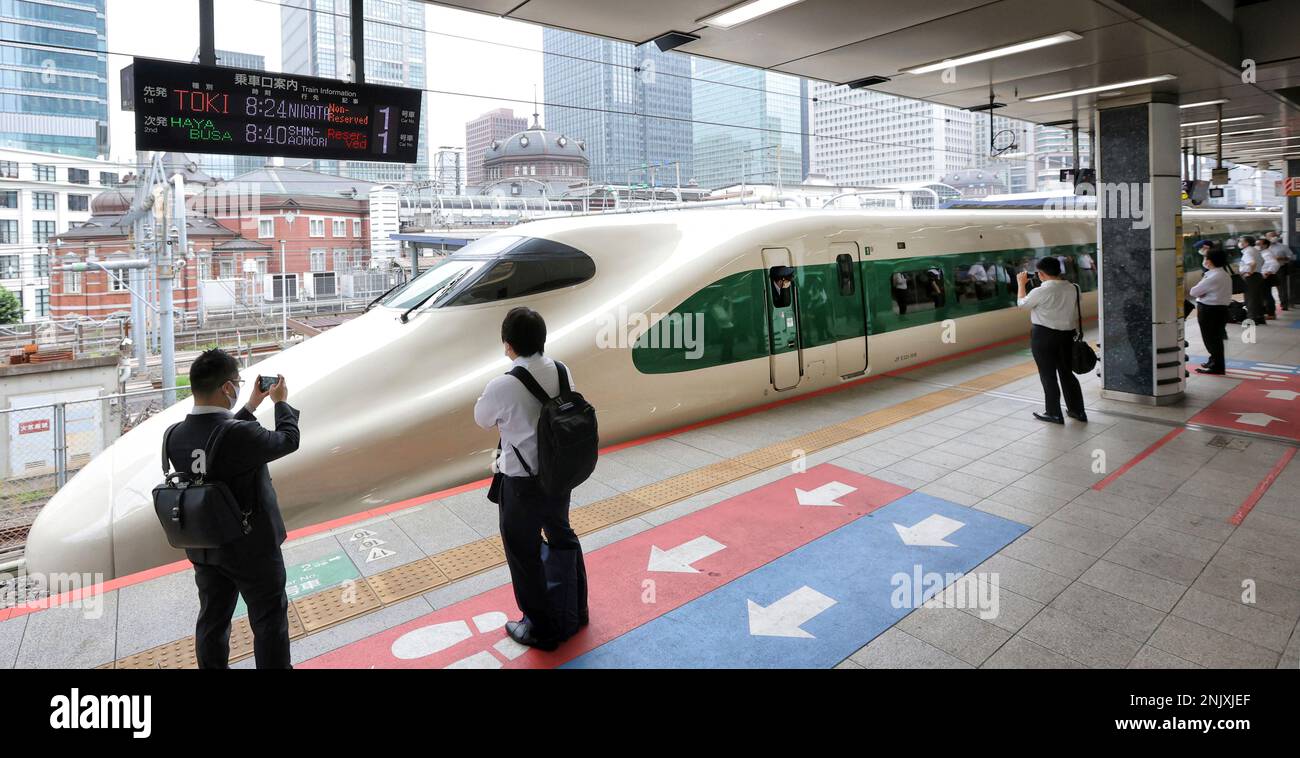 Tohoku Shinkansen bullet train painted with the design of the first ...