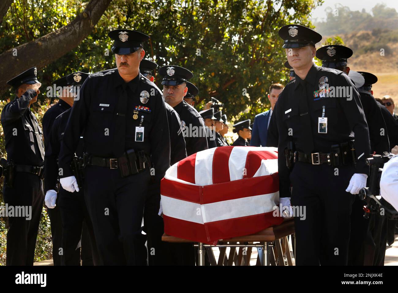 Los Angeles Police Department officers carry the casket of LAPD Officer ...