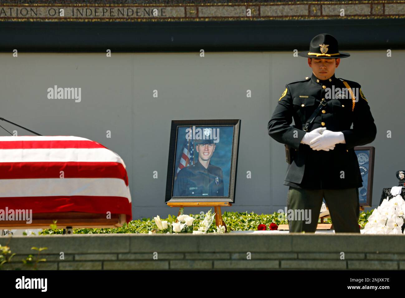 A picture of Los Angeles Police Officer Houston Tipping is set on the ...