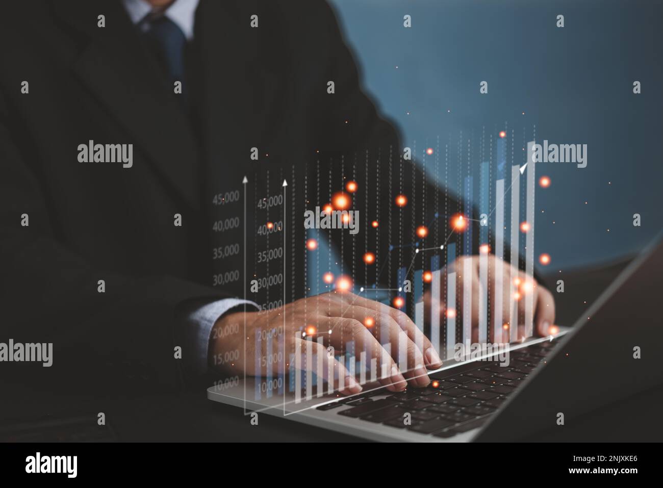 Businessman using tablet analyzing sales data and economic growth graph ...