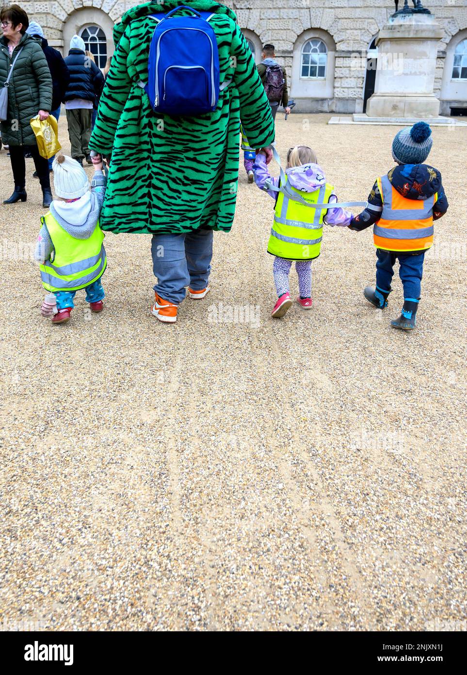 London, England, UK. Young children in hi-vis jackets taken for a walk ...