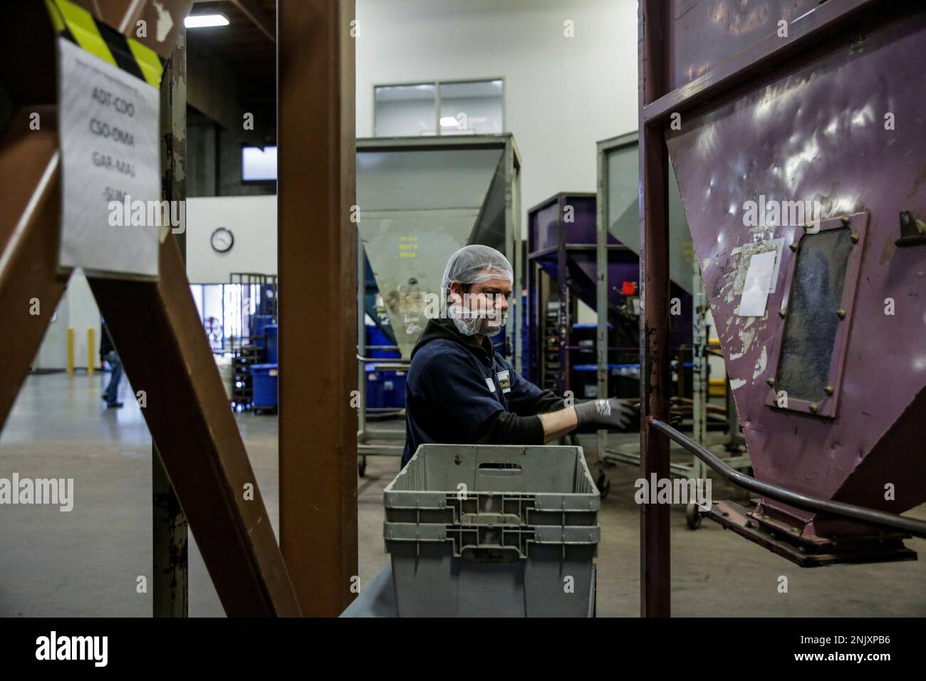 Rick Jacobus, who has been a roaster for 15 years, moves a rolling ...