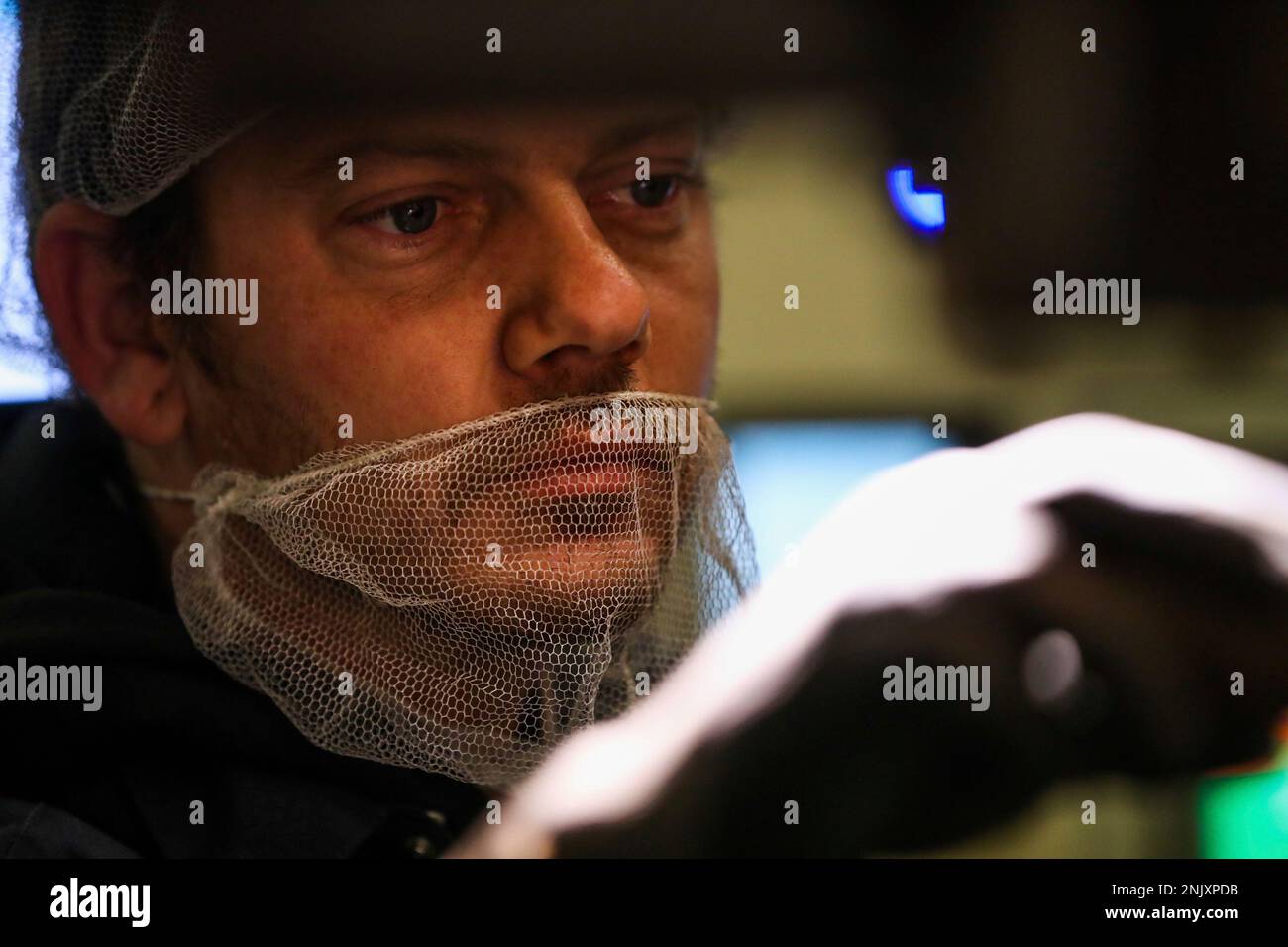 Rick Jacobus, who has been a roaster for 15 years, monitors a batch of ...