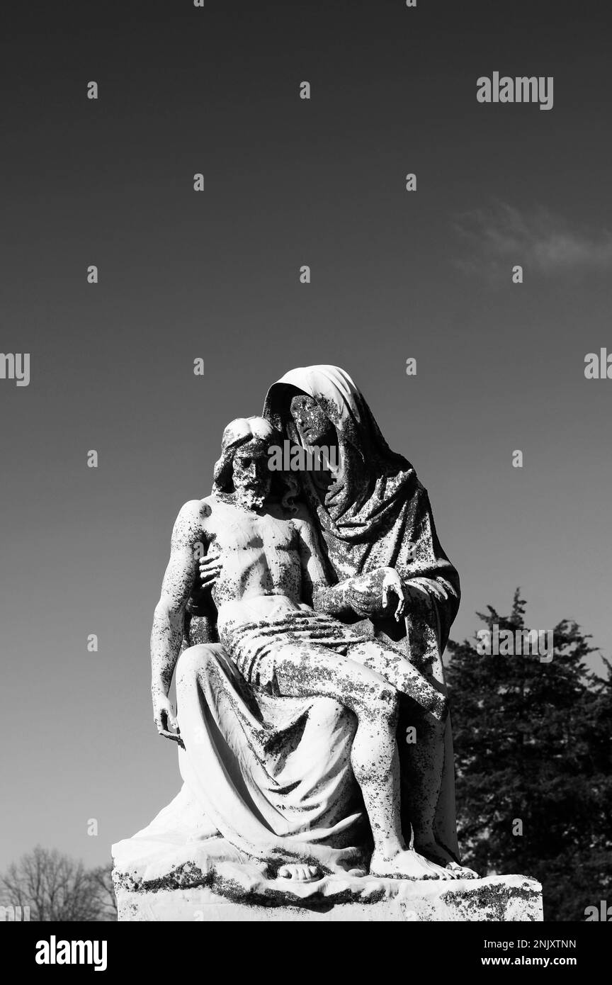 A natural stone statue replica of Michaelangelo's famous Pieta of the ...