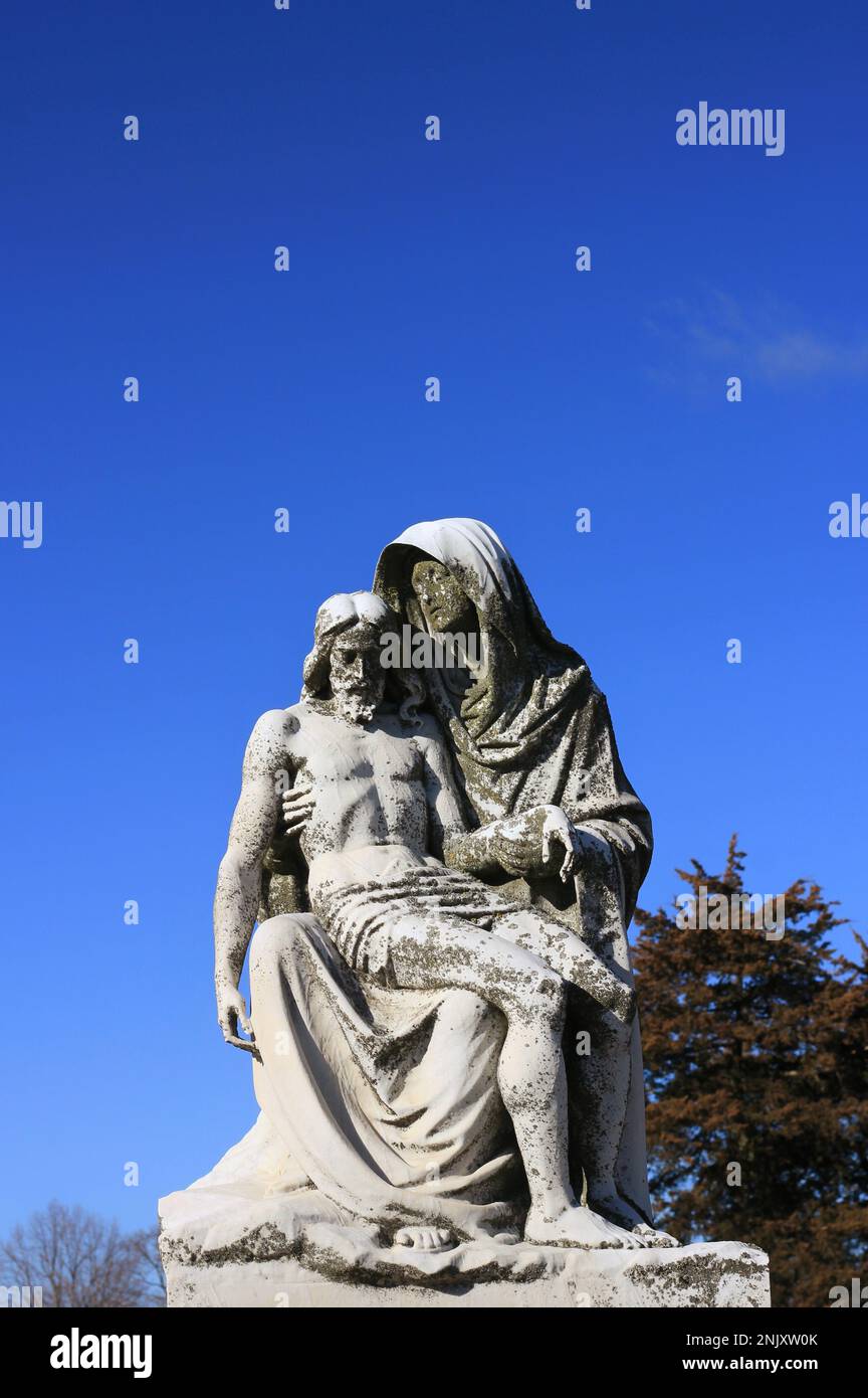 A natural stone statue replica of Michaelangelo's famous Pieta of the ...