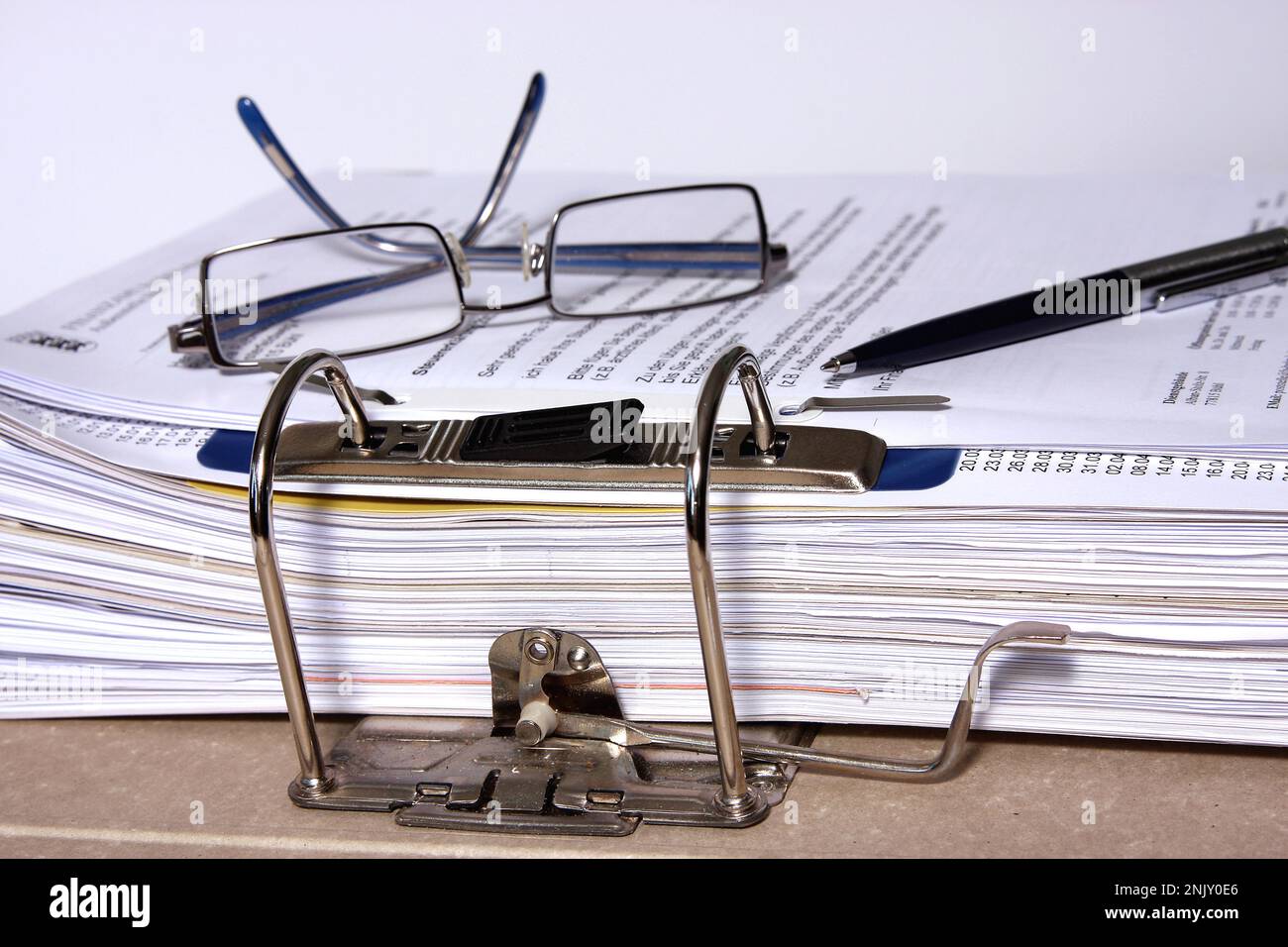 open filing folder with ballpen and spectacles Stock Photo - Alamy
