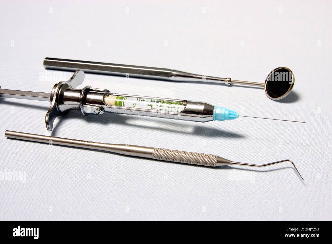 dental probe, mouth mirror and dental syringe, instruments of a dentist ...