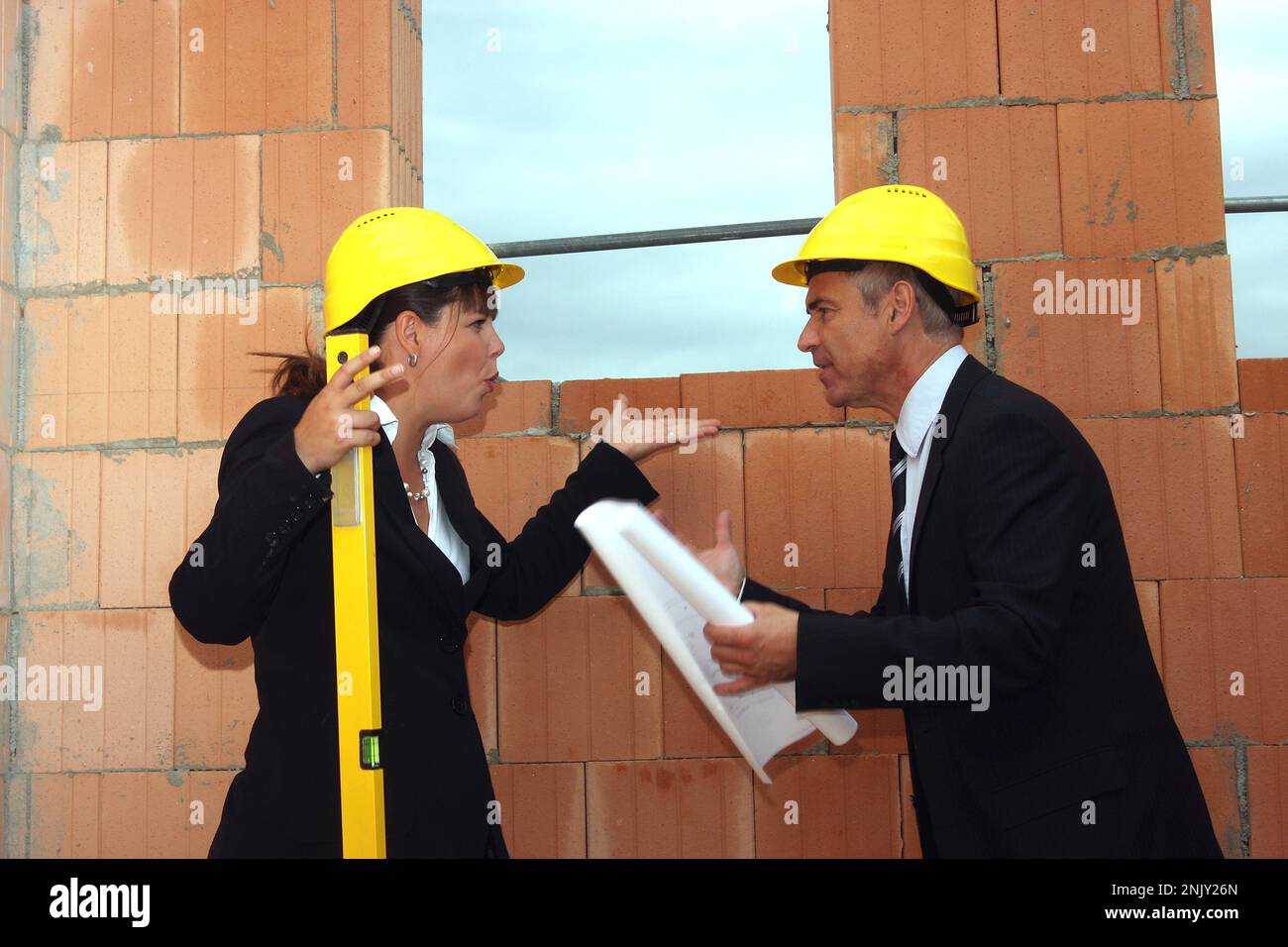 architects on the building site discussing Stock Photo - Alamy