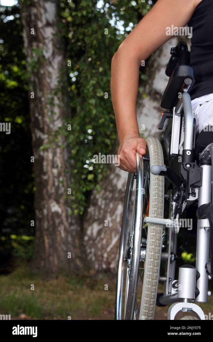 Disability wheelchair on path hi-res stock photography and images - Alamy