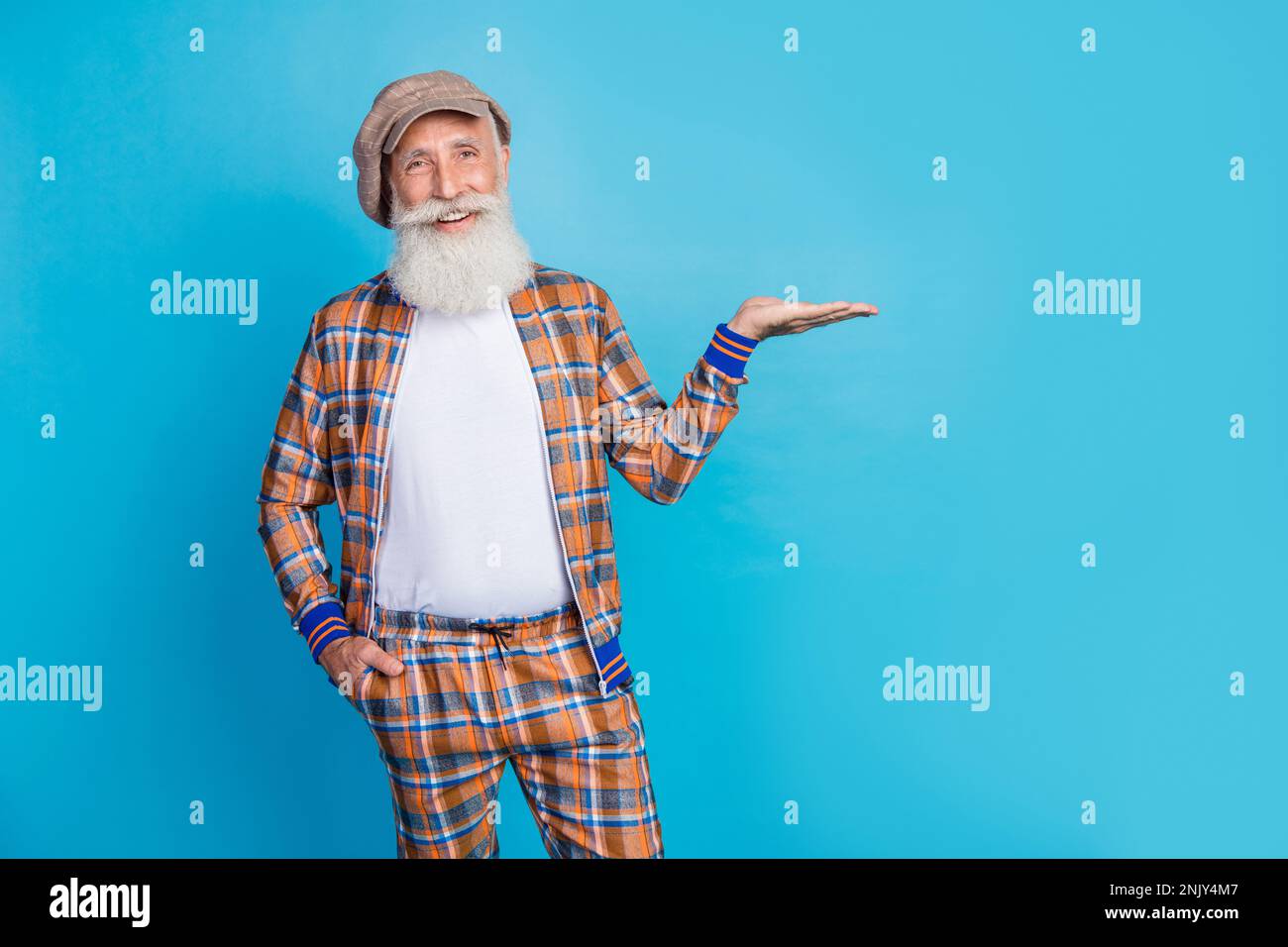 Photo of cool good mood man pensioner dressed checkered costume holding ...