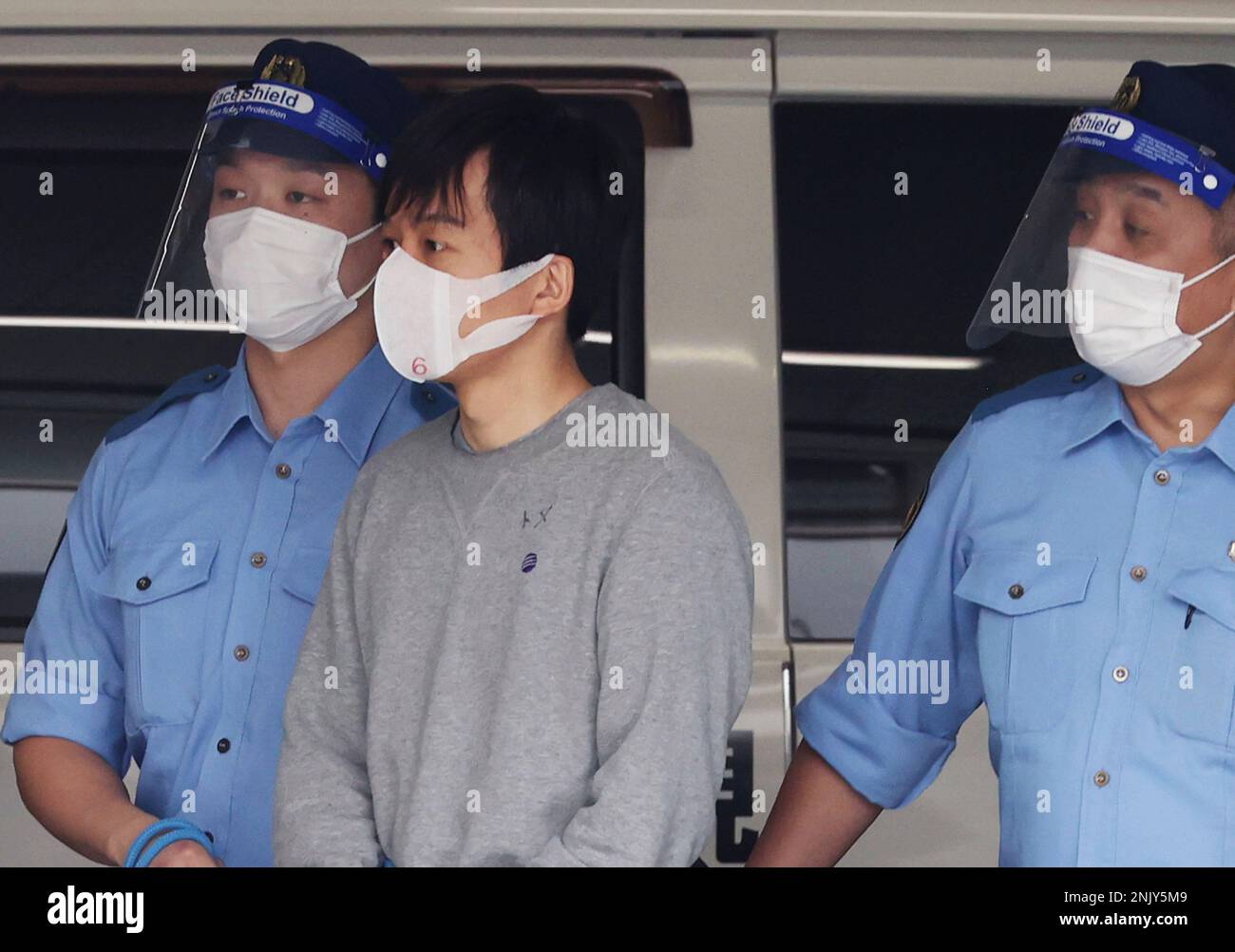 A suspect Hiroyuki Sanpei is transferred at Tomisaka Police Station in ...