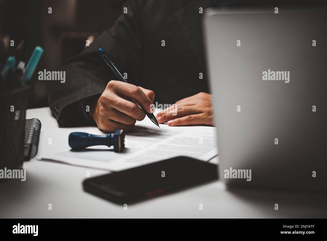 learning online class by using laptop computer and writing notebook at ...