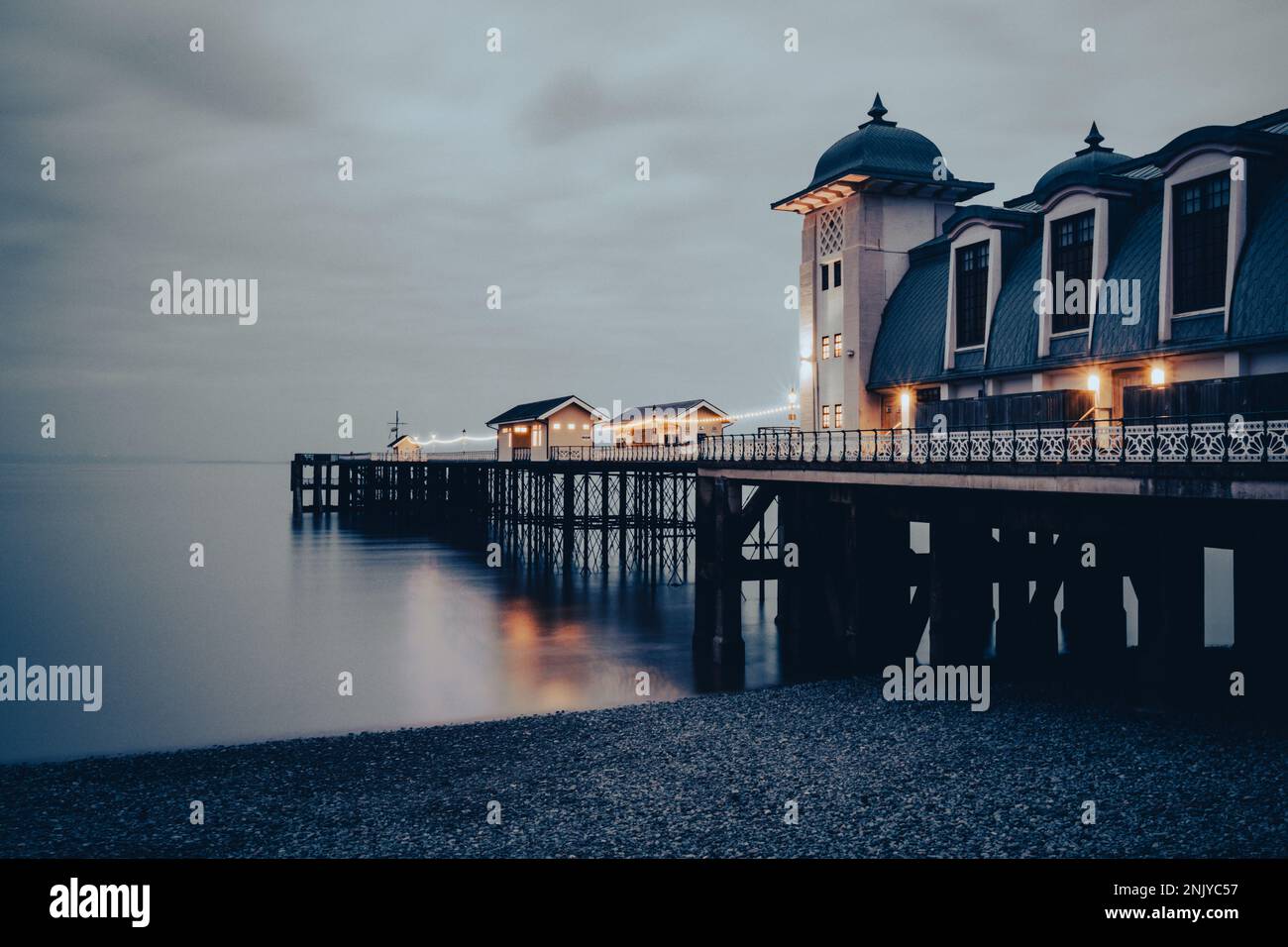 Penarth Pier at night, with reflections from the lights, appearing in ...