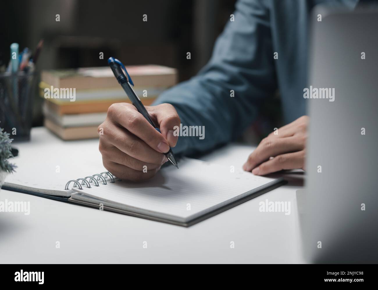 Businessperson reading and writing on book.education studying knowledge ...