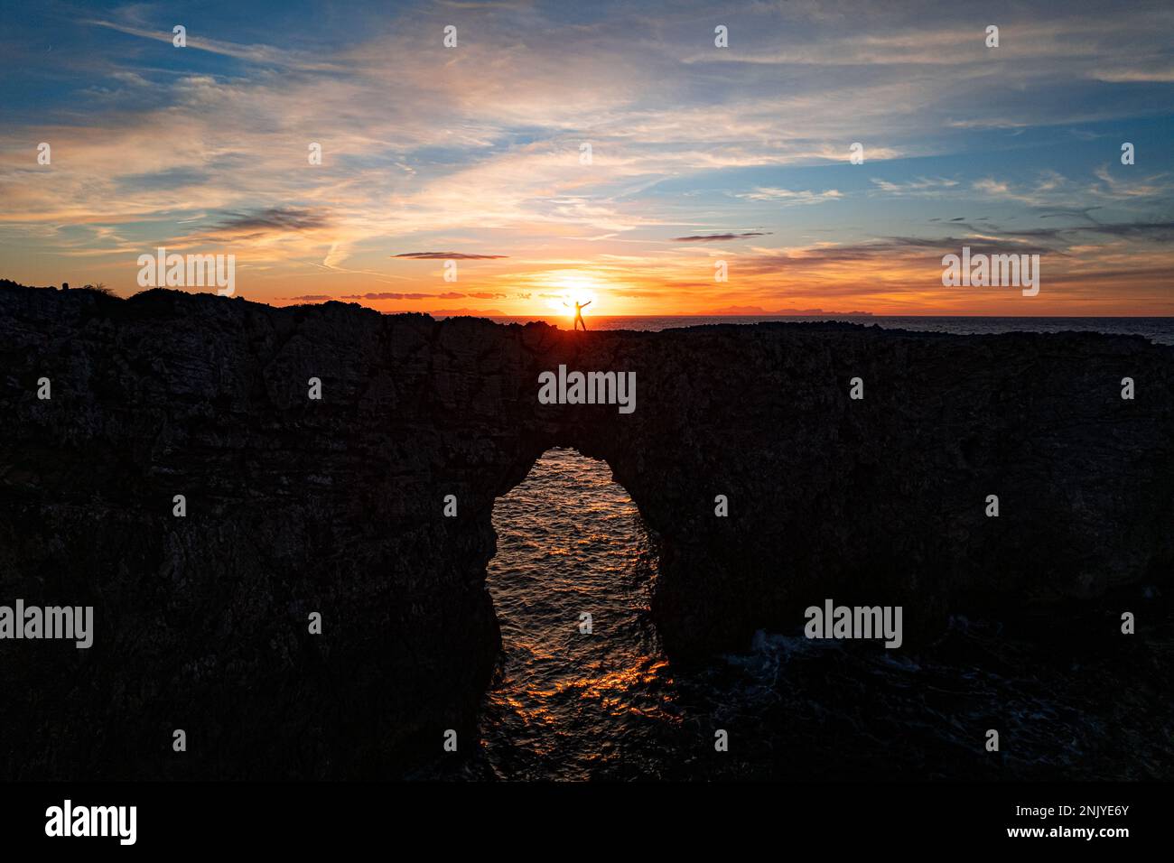 Amazing view of silhouette standing on Pont den Gil rocky bridge with ...