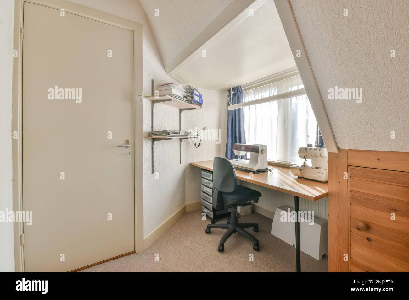 Interior of modern office with wooden table and chair near shelves ...