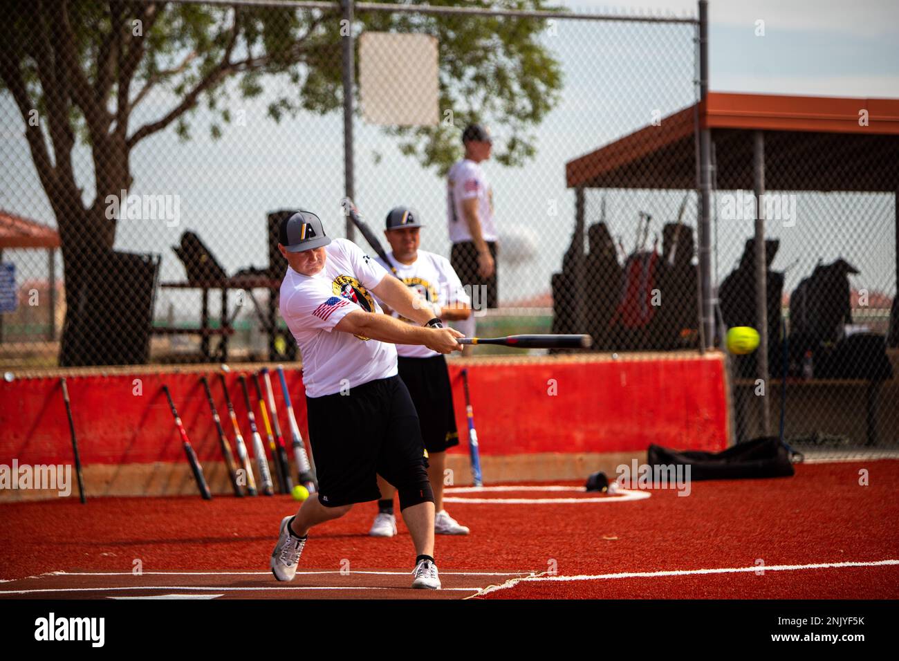 Sgt. 1st Class Travis Roop, Fort A.P. Hill EOD, takes a big swing at a ...