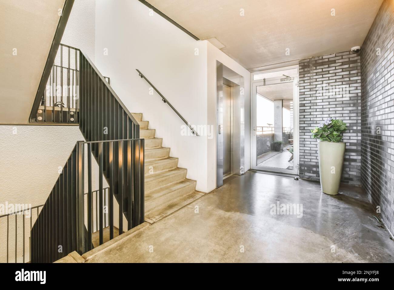 Interior design of modern entrance hall in apartment building with ...