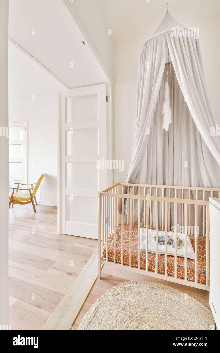 Interior design of modern nursery room in pastel colors with gray ...