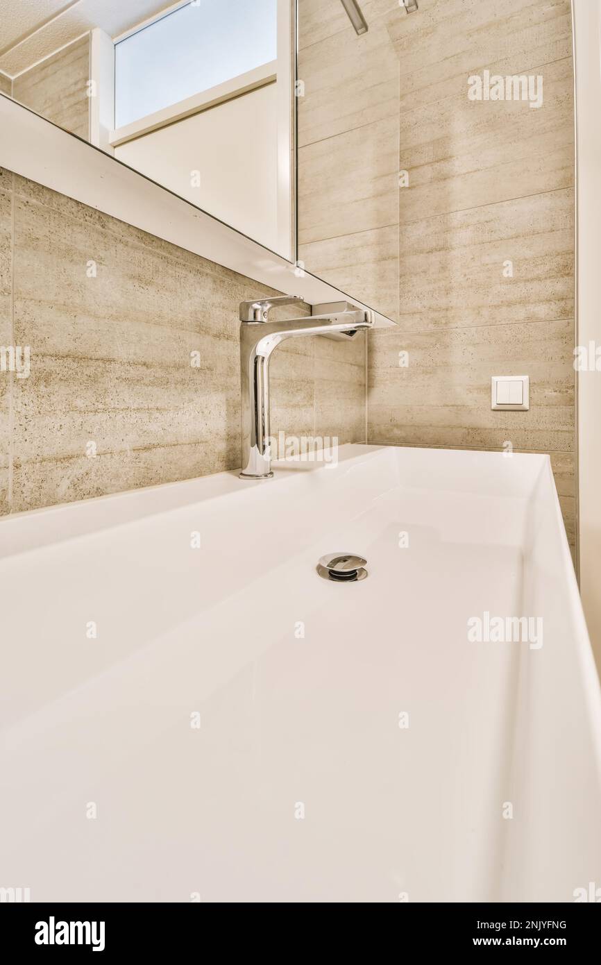 Interior design of contemporary bathroom with ceramic sink and faucet ...
