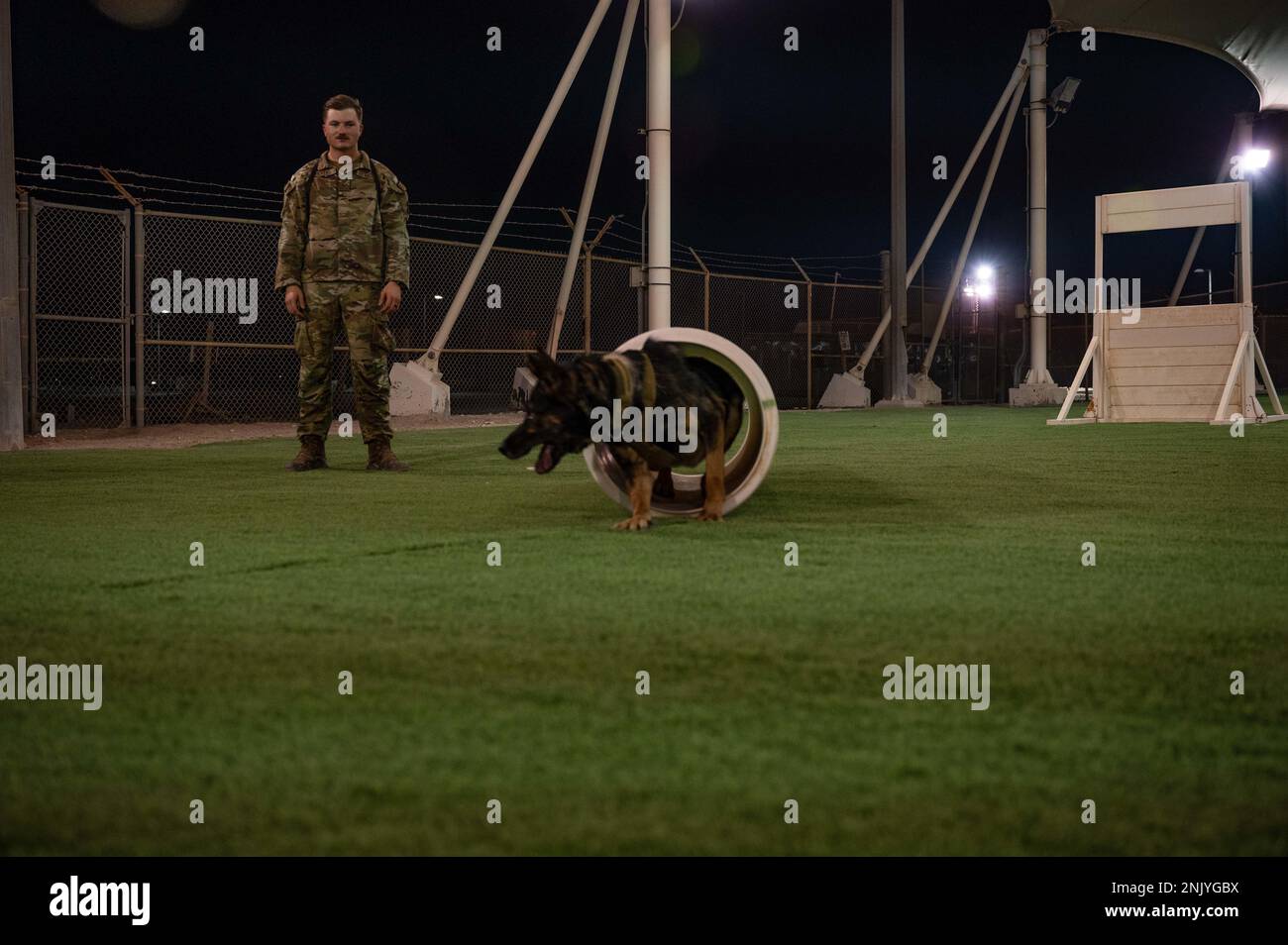 U.S. Air Force Staff Sgt. Justin Pickens, a military working dog ...