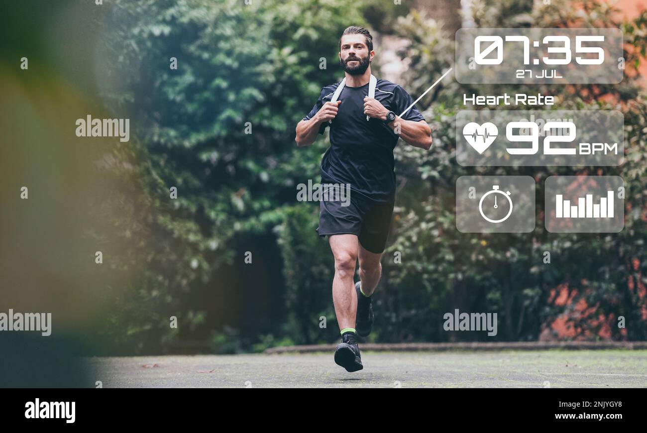 Man running in the park. Healthy runner with smart fit watch ...