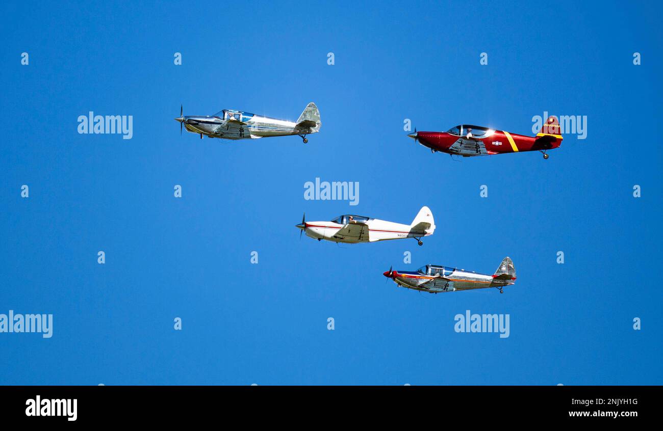 A group of four pilots perform a "fingertip" formation and other flight ...