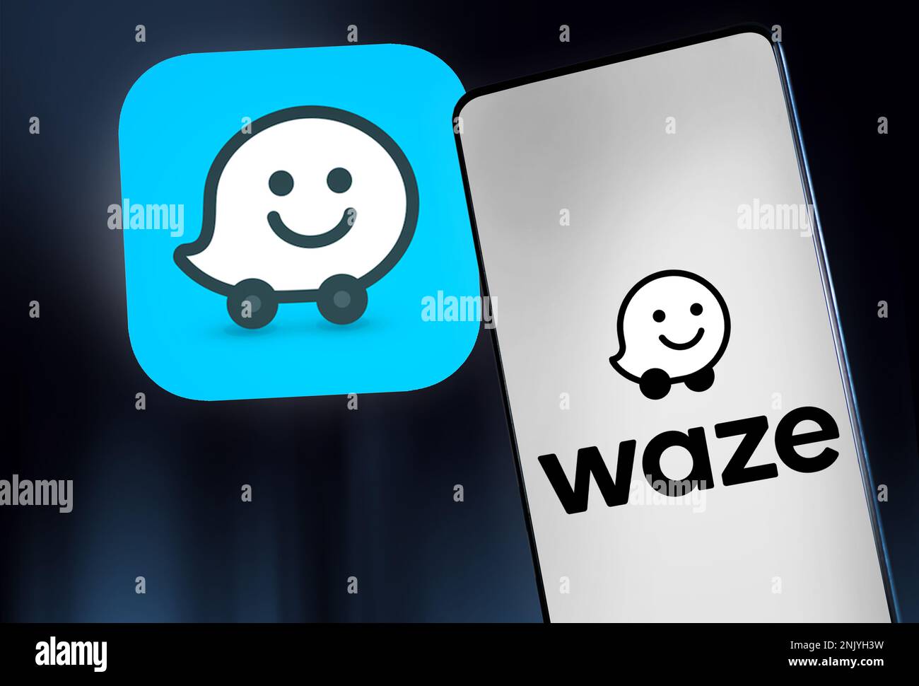 Waze logo on smartphone display and background. Driving direction ...