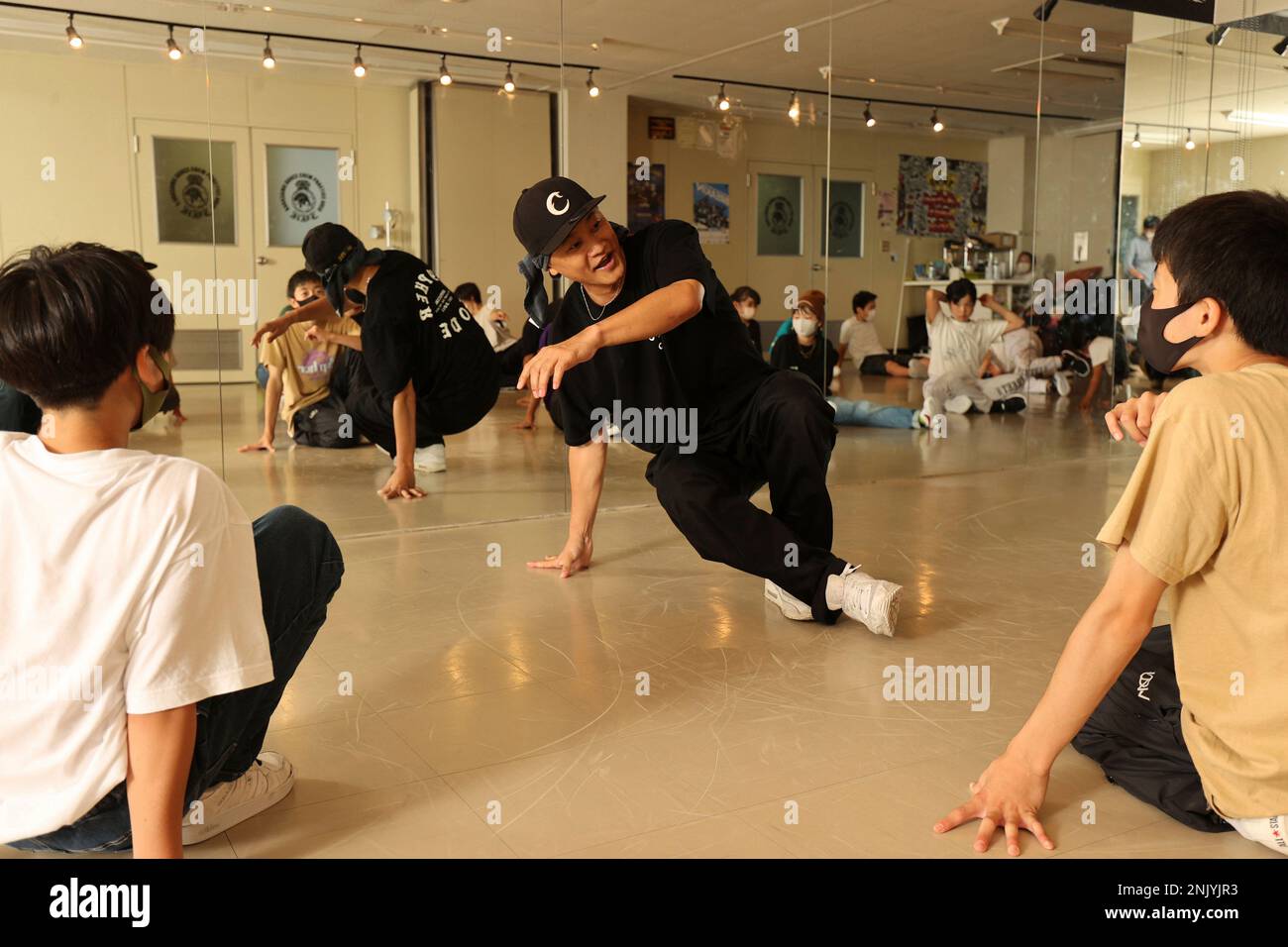 Japanese top breakdancer Katsuyuki Ishikawa, wearing a cap, performs ...
