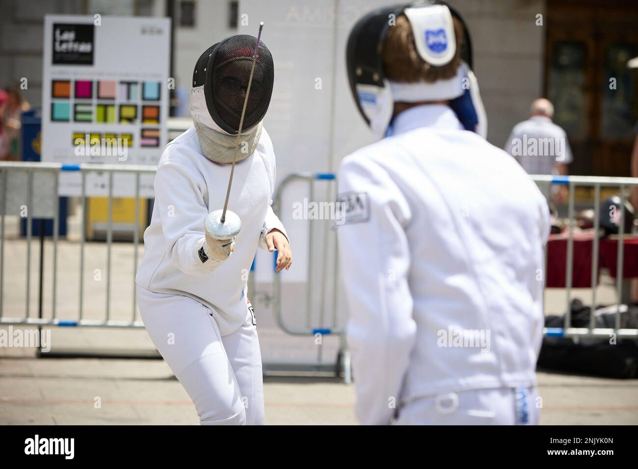 Two fencers practice a bout during a fencing exhibition in the Plaza de ...