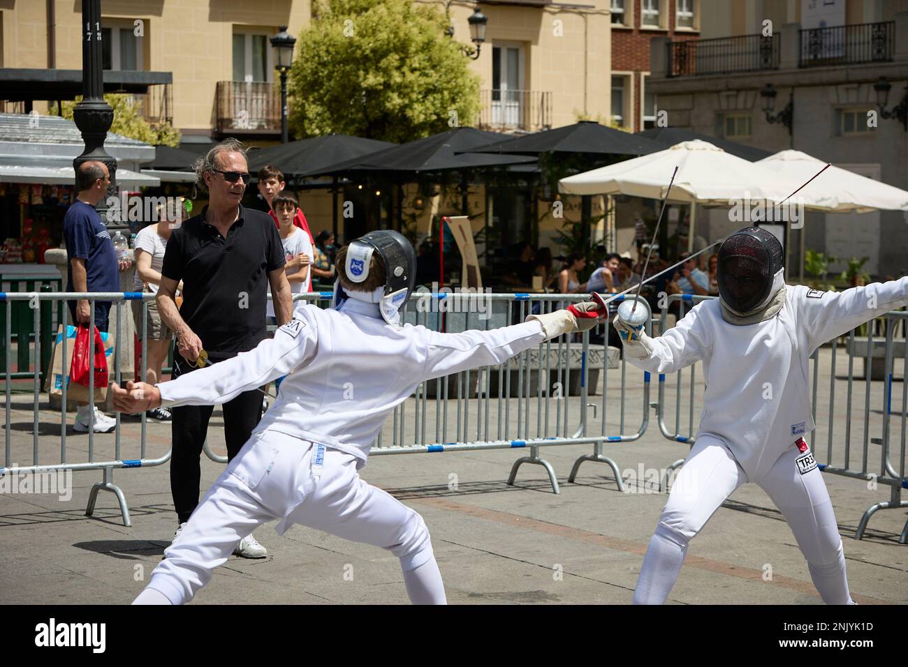 Two fencers practice a bout during a fencing exhibition in the Plaza de ...