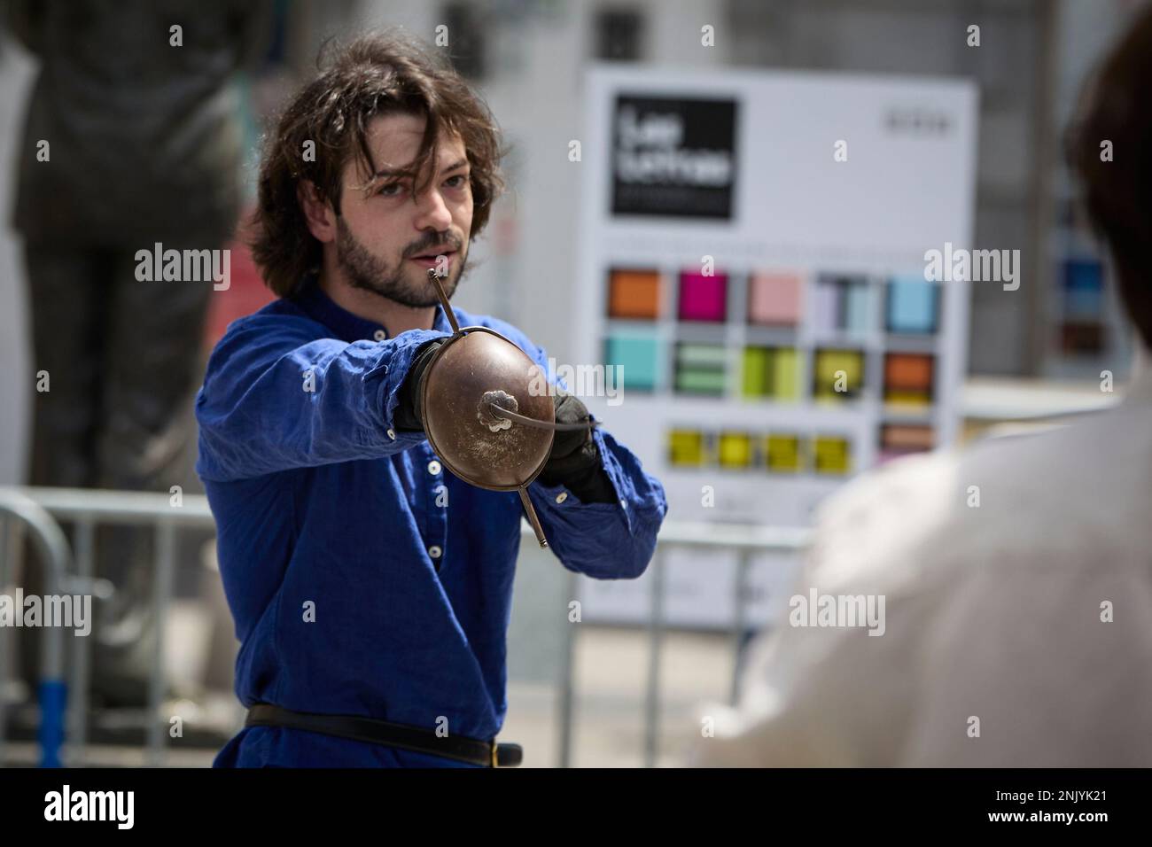 Two fencers practice a bout during a fencing exhibition in the Plaza de ...
