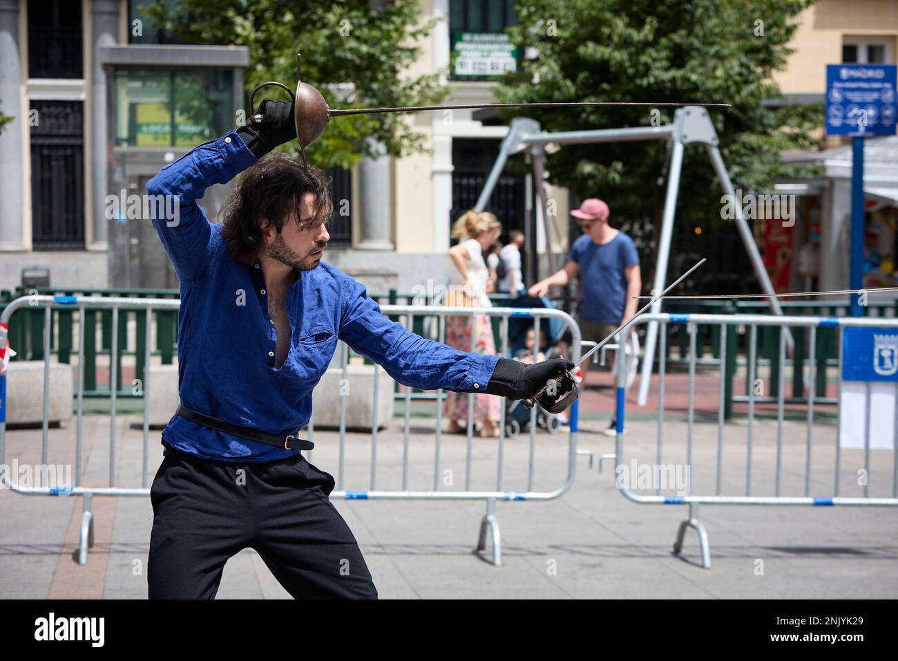 Two fencers practice a bout during a fencing exhibition in the Plaza de ...